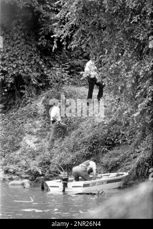 Investigators pull the body of missing person and victim Nathaniel ...
