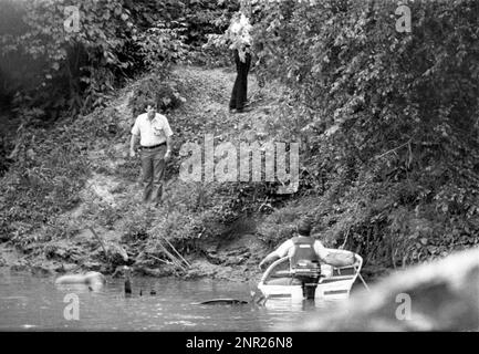 Investigators pull the body of missing person and victim Nathaniel ...