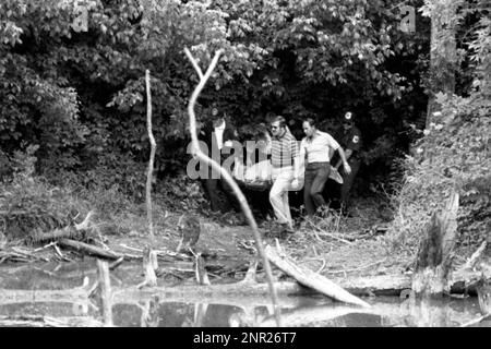 Investigators pull the body of missing person and victim Nathaniel ...