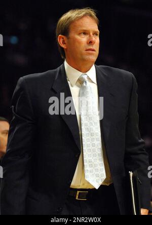 Kurt Rambis, center, of the Los Angeles Lakers, manages to sink a ...