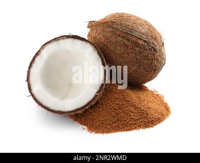 Ripe coconuts and pile of brown sugar on white background Stock Photo ...