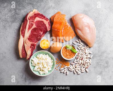 Assortment of natural sources of protein from food: meat, fish, chicken ...