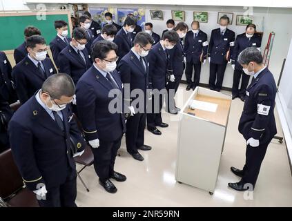 Station staffs offer flowers for victims who were killed in the sarin ...