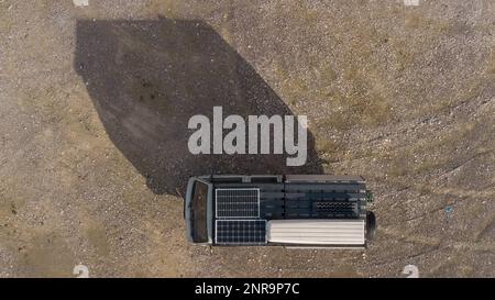 Drone view of camper van with roof solar panels on a wild beach Stock ...