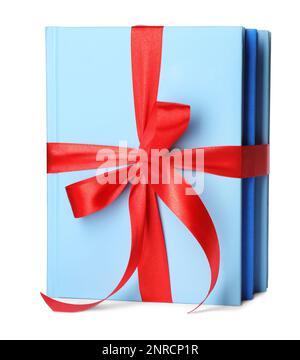 Different books tied with red ribbon isolated on white Stock Photo - Alamy