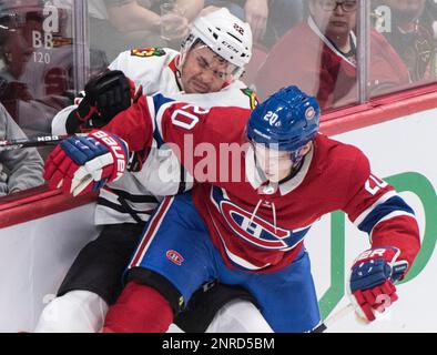 Montreal Canadiens' Cale Fleury (20) checks Calgary Flames' Zac Rinaldo ...
