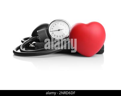 Blood pressure meter and toy heart on white background Stock Photo - Alamy
