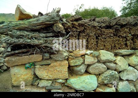 China, Tibet, Yak dung glued to a wall to dry, used as an alternative ...