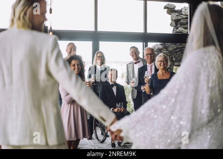 Wedding day. Hands in hands of newlywed couple Stock Photo - Alamy