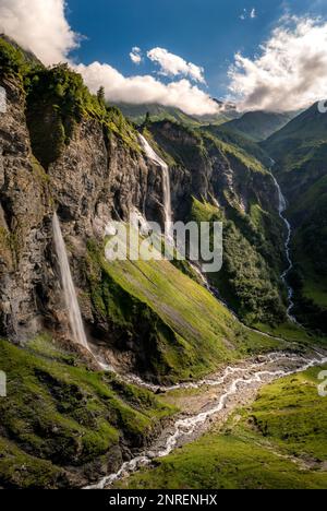several large waterfalls falling down a steep cliff Stock Photo - Alamy