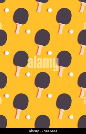 Pattern made of white ping pong ball on a bright yellow background ...