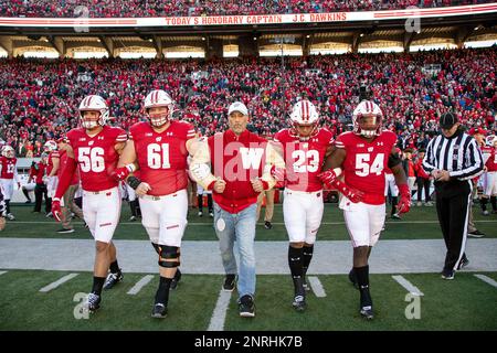 Wisconsin Badgers honorary captain Chris Maragos with captains Tyler ...