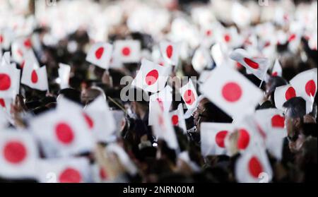 Japanese well-wishers hold Japanese national flag at the Imperial ...