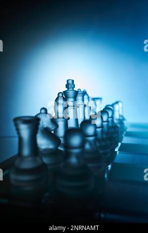 Chess figures made of glass. King in front magenta background Stock ...