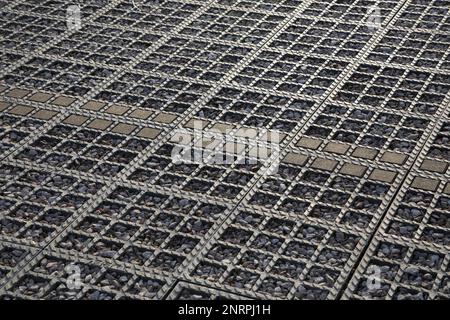 Permeable car park surface containing Gravel pebbles to allow standing ...