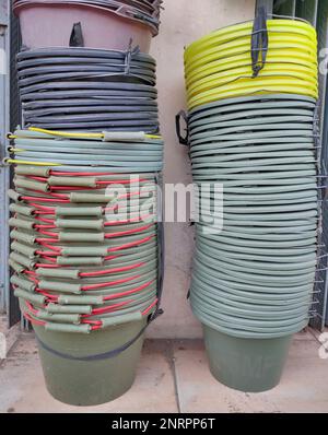 This arrangement of piles of buckets of various colors that will later ...
