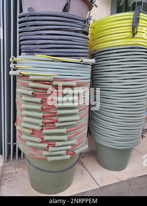 This arrangement of piles of buckets of various colors that will later ...