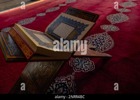 Islamic background photo. First pages of Quran on the lectern in the ...