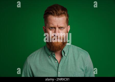 White ginger man with beard frowning and gesture at camera isolated ...