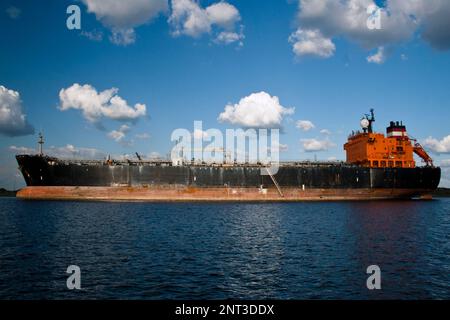 Moored 0il/chemical tanker with orange superstructure waiting for ...