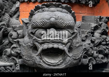 Black masks made of concrete at the temple's entrance in Nusa Dua, Bali ...