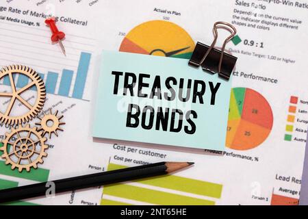 Papers with text, treasury bonds on a table, business concept Stock ...