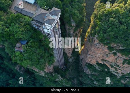 Aerial view of the Bailong Elevator built on a cliff in Zhangjiajie in ...