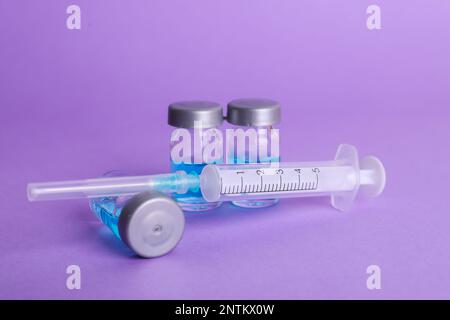 Disposable syringe with needle and vials on white background Stock ...