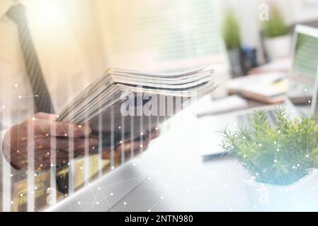 Hands of businessman holding magazines; multiple exposure Stock Photo ...