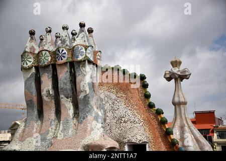 Amazing architecture of chimneys and cross on top of Barcelona ...