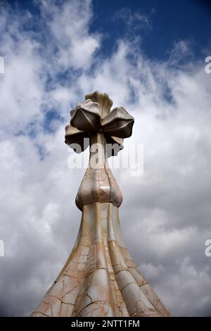 Amazing architecture of chimneys and cross on top of Barcelona ...