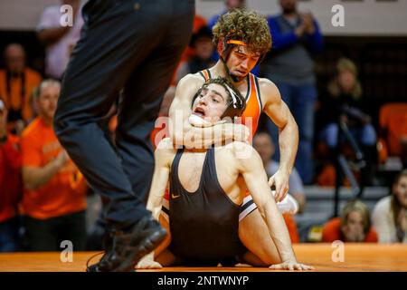 Oklahoma State's Daton Fix attempts to turn Iowa's Austin DeSanto ...