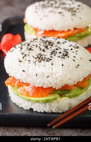 Avocado sushi roll on black slate board Stock Photo - Alamy