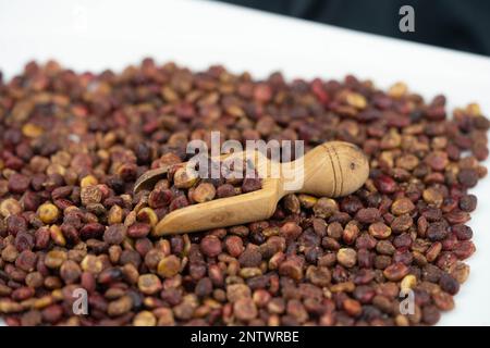 red Turkish Sumach rhus coriaria on olive wood Stock Photo - Alamy