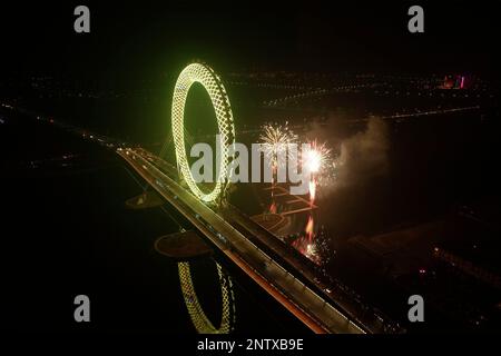A Ferris wheel called Eye of Bohai changes color in the night of ...