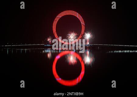 A Ferris wheel called Eye of Bohai changes color in the night of ...