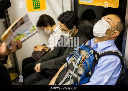 Passengers sleeping in Keio line. Tokyo. Japan Stock Photo - Alamy