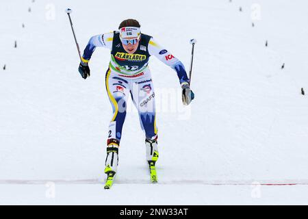 Ebba Andersson, of Sweden, crosses the finish line to win the gold ...