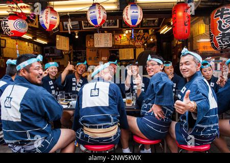 Bearers of Mikoshi eating in restaurant,during Sanja Matsuri Festival ...