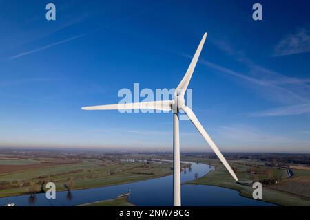 Contrasting closeup of wind turbine and against clear blue sky in The ...