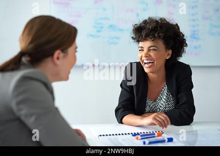 Theyve got great coworker rapport. Shot of two businesswomen enjoying a ...