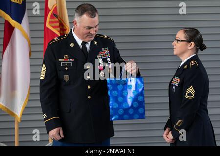 Command Sgt. Maj. Randy Ly, right, completes his last official duty for ...