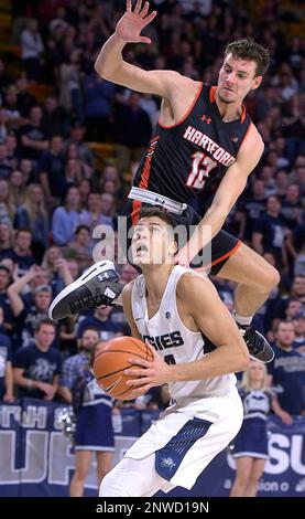 Hartford guard Jason Dunne (12) drives into Mississippi State guard ...
