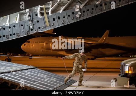 Senior Airman Matthew Warren, 3rd Airlift Squadron loadmaster, controls ...