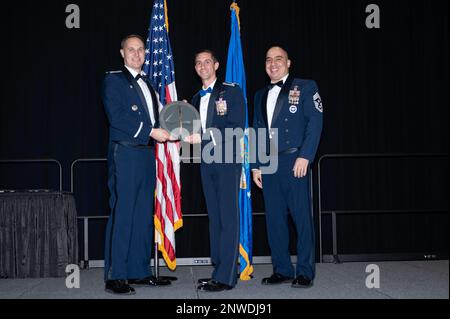 Col. Lucas Teel, left, 4th Fighter Wing commander, presents Maj. Samuel ...