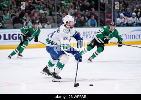 Vancouver Canucks defenseman Kyle Burroughs (44) knocks down the puck ...