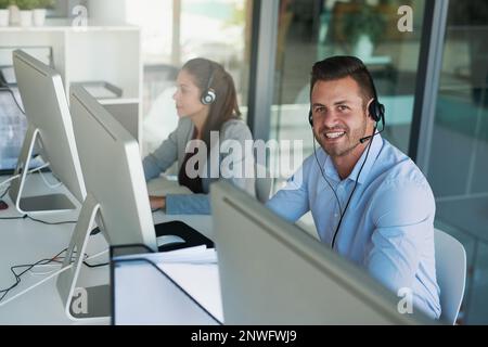 Customer care you can count on. Portrait of a happy and confident young ...