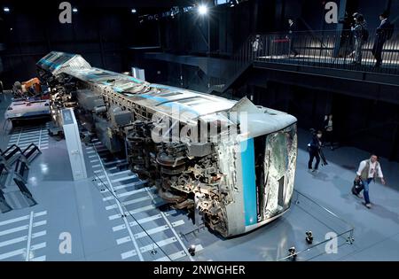 Damaged Joban Line train (L) and Shinkansen bullet train are placed at ...