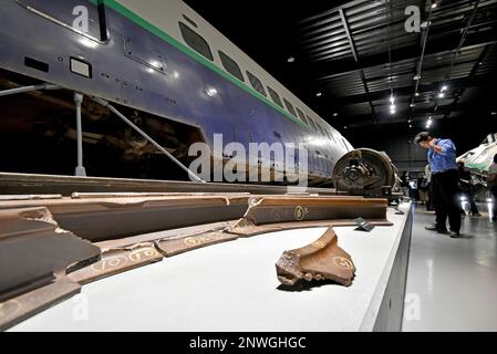 Damaged Joban Line train (L) and Shinkansen bullet train are placed at ...