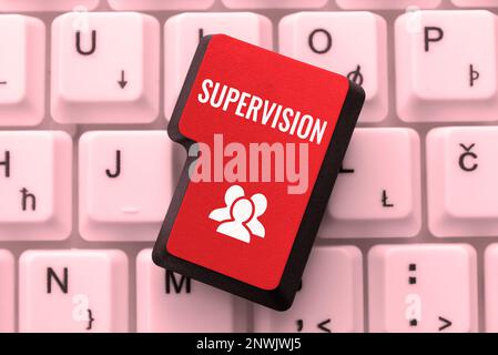 Sign displaying Supervision, Business overview monitoring and ...